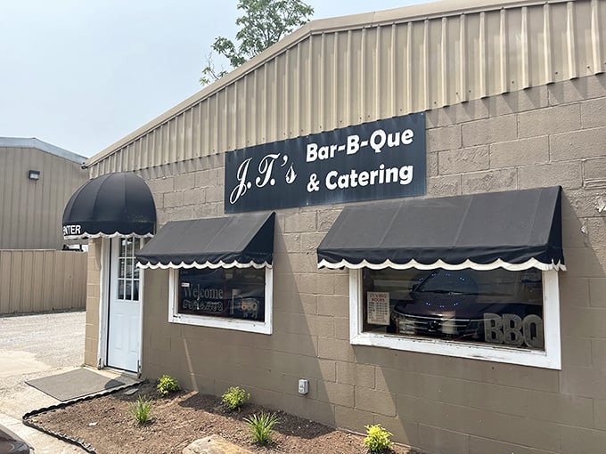 J.T.'s modest exterior with classic black awnings&mdash;the barbecue equivalent of finding an unsigned Picasso at a yard sale.