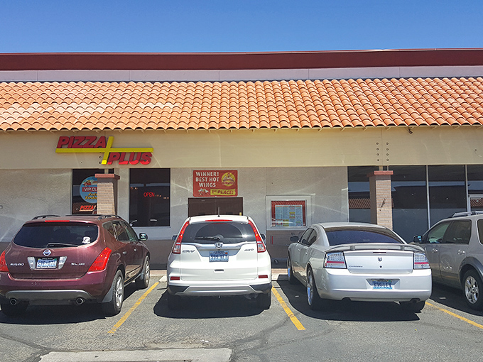 Pizza Plus: Where sports fans and pizza lovers form a perfect union. Those red walls contain more flavor than meets the eye.