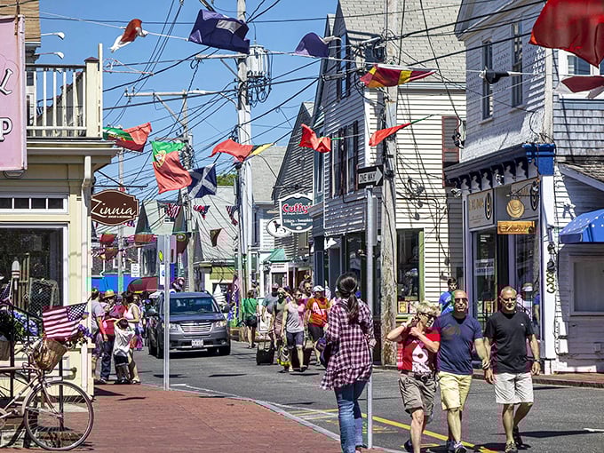 Provincetown's Commercial Street buzzes with life, flags fluttering overhead like a permanent celebration of diversity and art.