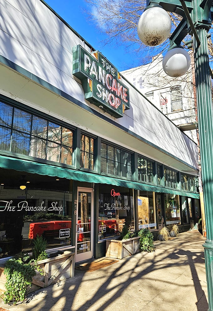 The Pancake Shop's classic storefront with green awnings is Hot Springs' most reliable morning miracle since the thermal waters.