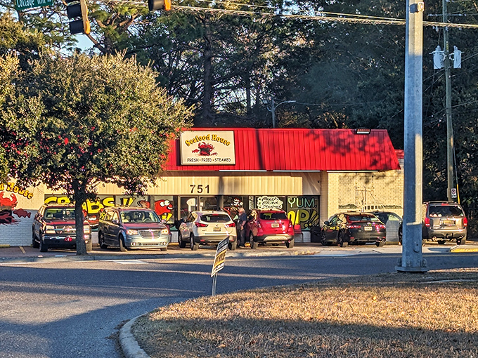 The Seafood House's bold red and yellow exterior is like that friend who's loud but always delivers on promises of good times.