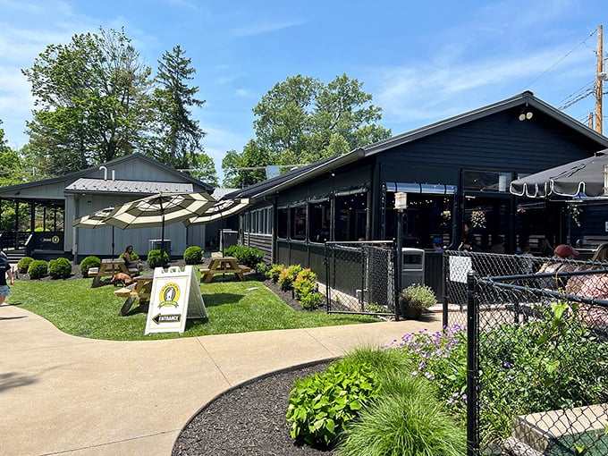  Black-and-white striped umbrellas shade picnic tables where pizza epiphanies happen daily at this Fayetteville institution.