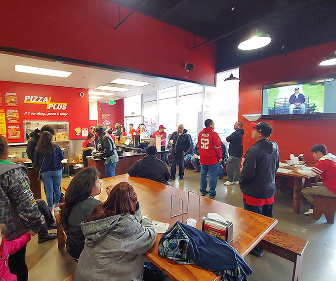  Pizza Plus: Strip mall on the outside, Italian grandmother's kitchen on the inside. That simple sign promises straightforward deliciousness without pretense.