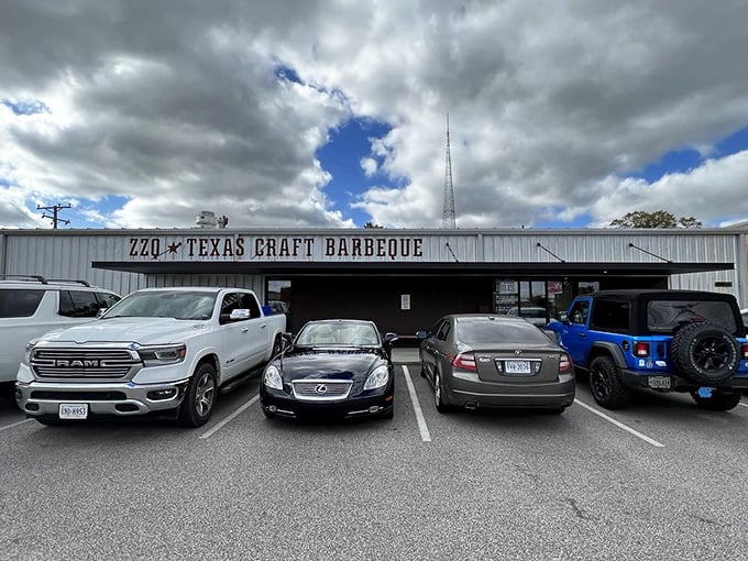 ZZQ's metal building houses meat magic that would make a Texan proud. Those parked cars contain people who understand that great barbecue is worth the trip.