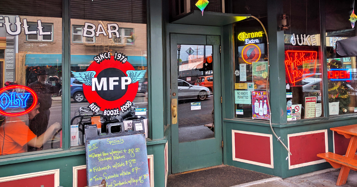 Sunlight catches the vintage storefront of My Father's Place &ndash; where Portland's most authentic dive experience awaits with zero pretension and maximum character.