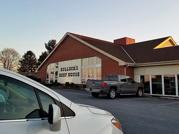 The brick facade of Bullock's Beef House stands like a carnivore's lighthouse, beckoning hungry travelers through Carroll County's rolling countryside.