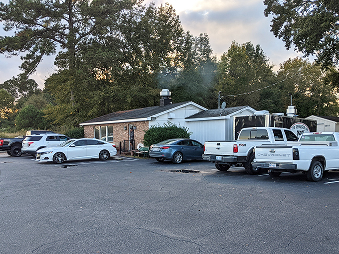 The unassuming exterior hides culinary greatness like a superhero's secret identity. Hungry pilgrims gather outside, knowing what awaits. 