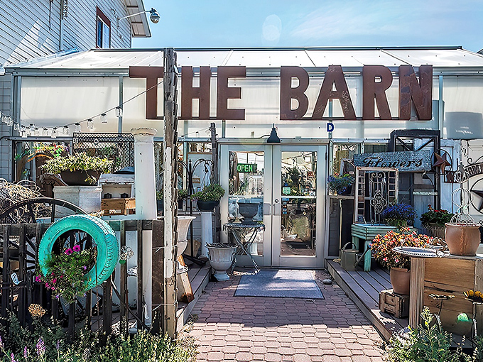 That iconic rusty sign isn't just weathered&mdash;it's a beacon calling to treasure hunters everywhere. The Barn's exterior promises adventures within.