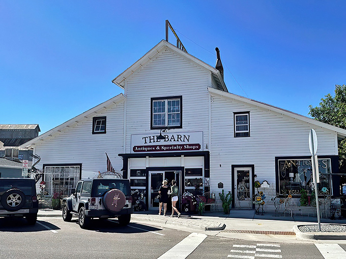 That iconic rusty sign isn't just weathered&mdash;it's a beacon calling to treasure hunters everywhere. The Barn's exterior promises adventures within.