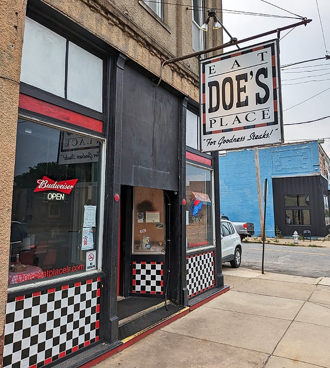 The unassuming exterior of Doe's Eat Place hides culinary greatness within, like finding a diamond in your backyard. That yellow truck knows what's up!