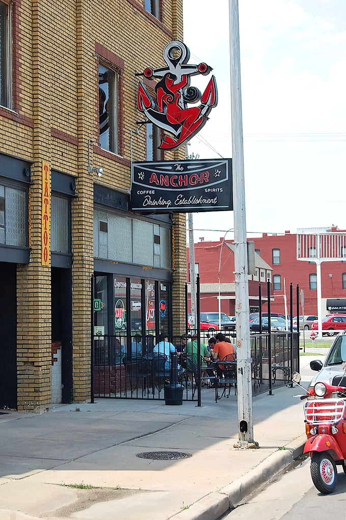 The iconic red anchor sign glows like a beacon against the historic yellow brick, guiding hungry souls to sandwich salvation. 