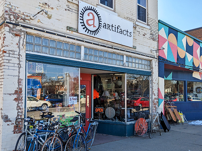 The iconic red door beckons treasure hunters like a portal to the past. Those vintage Radio Flyers aren't just for show!