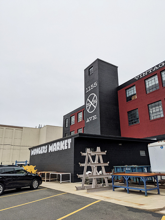 The iconic red brick and black smokestack of Mongers Market stands proudly on Railroad Avenue, a beacon for treasure hunters and nostalgia seekers.