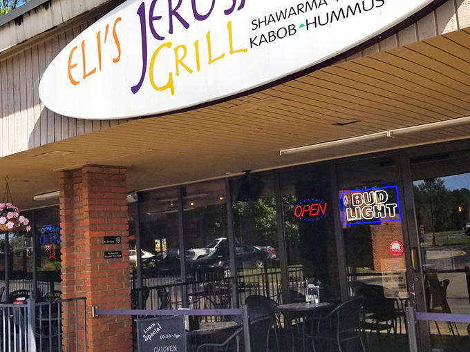 The unassuming storefront of Eli's Jerusalem Grill belies the culinary treasures waiting inside. Sometimes the best global cuisine hides in plain sight.