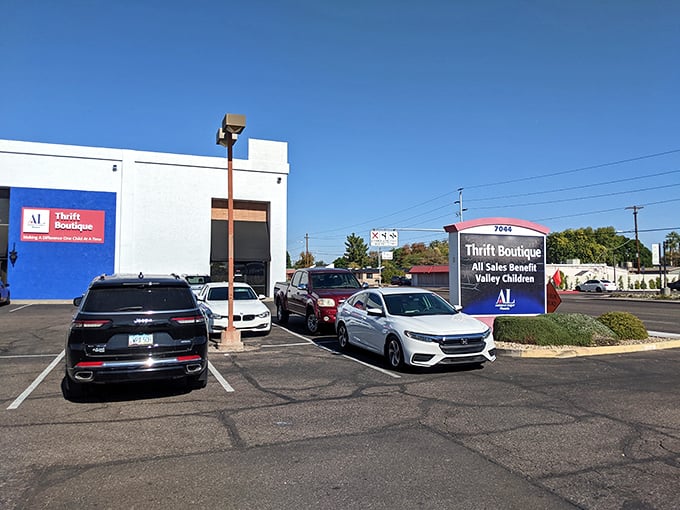 The bright blue exterior stands out like a sapphire in the desert, promising air-conditioned treasure hunting within. No mirage here, folks!