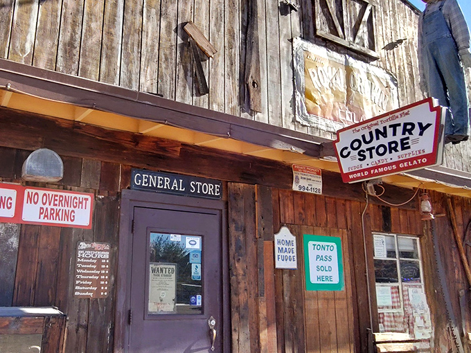 The weathered wooden facade of Tortilla Flat Saloon stands defiantly against time, a slice of the Wild West complete with authentic frontier charm and a Coca-Cola sign that's seen it all.