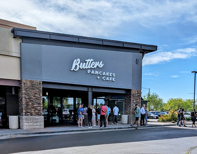 The stone-accented facade of Butters Pancakes & Cafe doesn't just welcome you&mdash;it practically issues a breakfast challenge to the line of eager patrons.