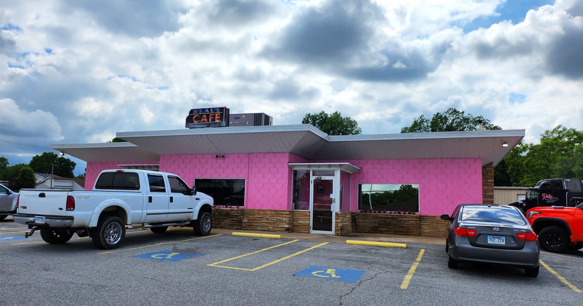 The pink palace of poultry stands proudly against the Arkansas sky, like a delicious mirage beckoning hungry travelers from miles around.