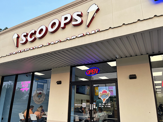 Scoops Homemade Ice Cream stands proudly in Hot Springs, its cheerful yellow facade promising sweet relief from Arkansas summer heat. The "OPEN" sign never looked so inviting.