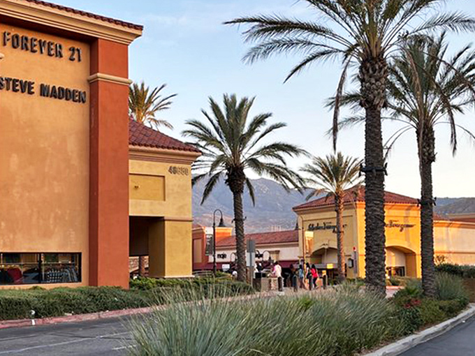 Desert chic meets shopping paradise at Desert Hills Premium Outlets, where terra cotta buildings and palm trees frame your bargain-hunting adventure.