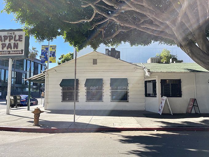 The unassuming exterior of The Apple Pan stands like a time capsule amid modern LA, its vintage sign promising "Quality Forever" &ndash; a bold claim they've somehow managed to keep.