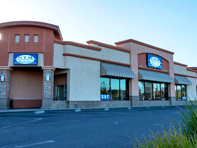 The unassuming exterior of GTM Stores in Santee hides a treasure trove of bargains within, like a discount speakeasy that everyone's invited to.