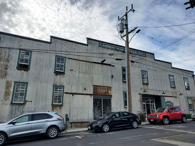 The weathered corrugated exterior of Cannery Row Antique Mall stands as a time capsule itself, housing treasures that span decades within its industrial bones.