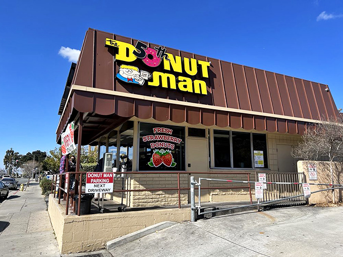 The brown building with the iconic yellow sign has become a Route 66 landmark. Like a donut beacon in the night, it calls to hungry travelers.