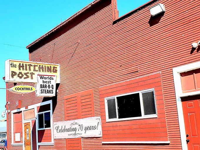 The iconic red exterior of Hitching Post stands like a beacon in tiny Casmalia, promising carnivorous delights that have drawn pilgrims for generations.