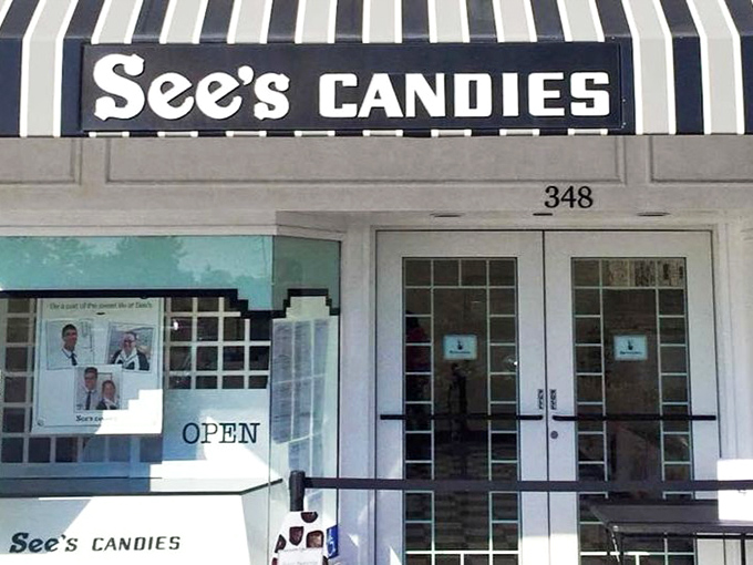 The iconic white building with black trim stands like a temple to sweetness, beckoning chocolate pilgrims with its timeless charm.