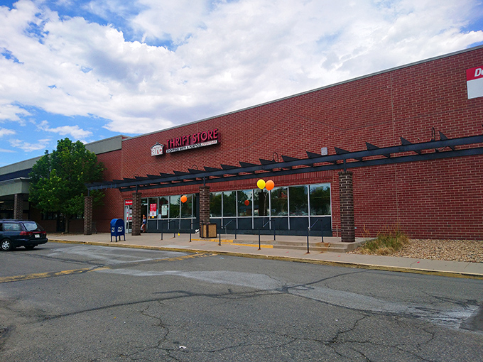 The unassuming brick exterior of arc Thrift Store hides a treasure trove within, like finding a speakeasy but for vintage bargains instead of cocktails.
