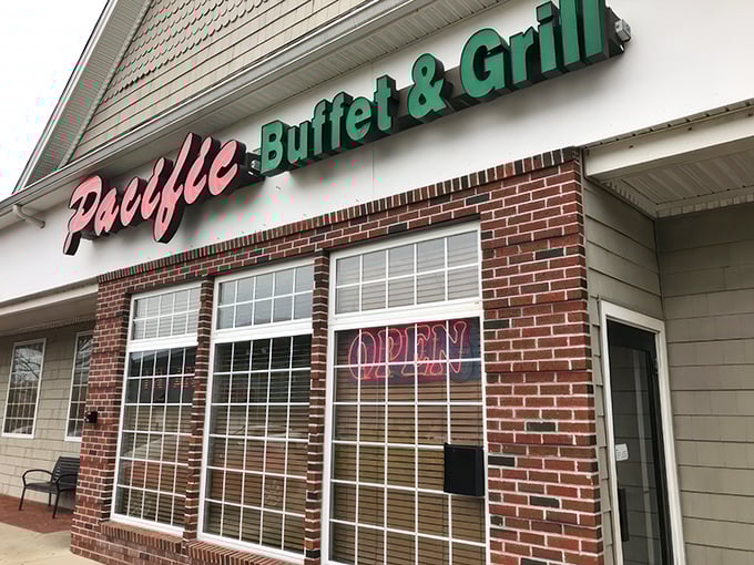 The red and green neon sign of Pacific Buffet & Grill beckons like a lighthouse for the hungry traveler navigating suburban Connecticut.