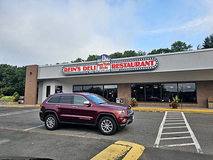 A neon beacon of deliciousness! Rein's Deli's sign promises New York-style eats that'll transport your taste buds faster than a subway ride to Manhattan.