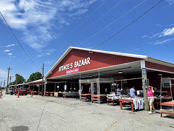 The iconic red facade of Spence's Bazaar stands like a beacon for bargain hunters, promising treasures waiting to be discovered inside and out.