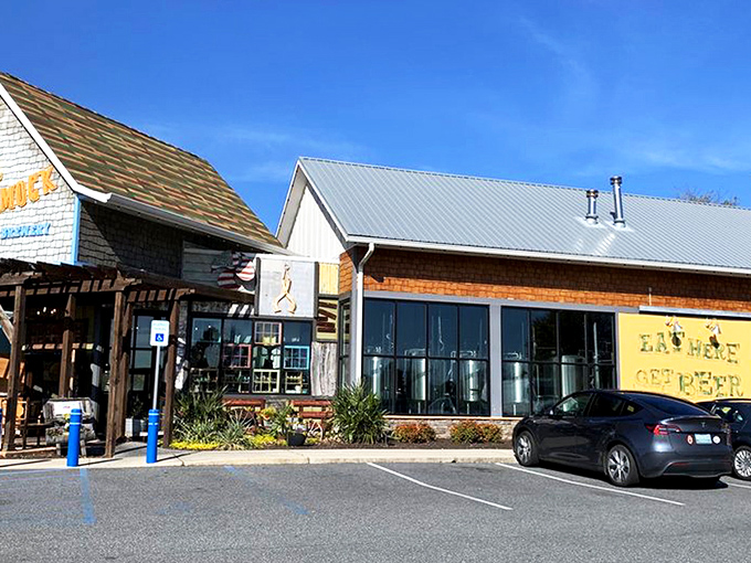 Sunshine, blue skies, and that inviting coastal architecture &ndash; the Crooked Hammock's exterior practically whispers, "Your afternoon plans? They're right here."
