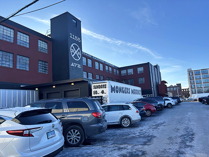 The iconic red brick and black smokestack of Mongers Market stands proudly on Railroad Avenue, a beacon for treasure hunters and nostalgia seekers.