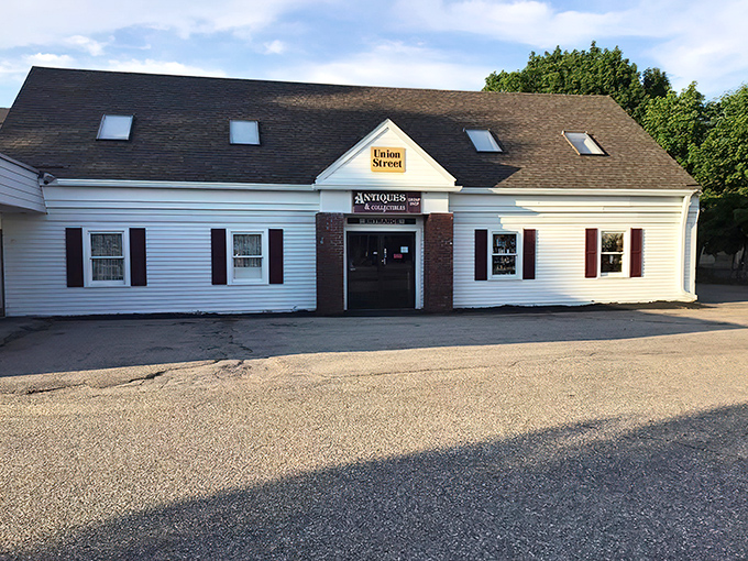 The unassuming exterior of Union Street Antiques beckons with its yellow sign and classic New England charm&mdash;a time portal disguised as a simple white building.
