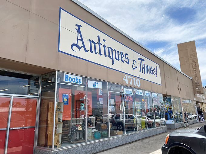 The storefront beckons with promises of treasures within, its blue lettering against beige like a desert sky invitation to explore.