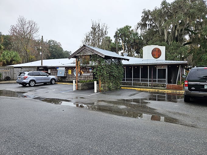 The unassuming entrance to culinary paradise. Spanish moss and Florida pines stand guard over this literary landmark that's been serving authentic flavors since 1952.