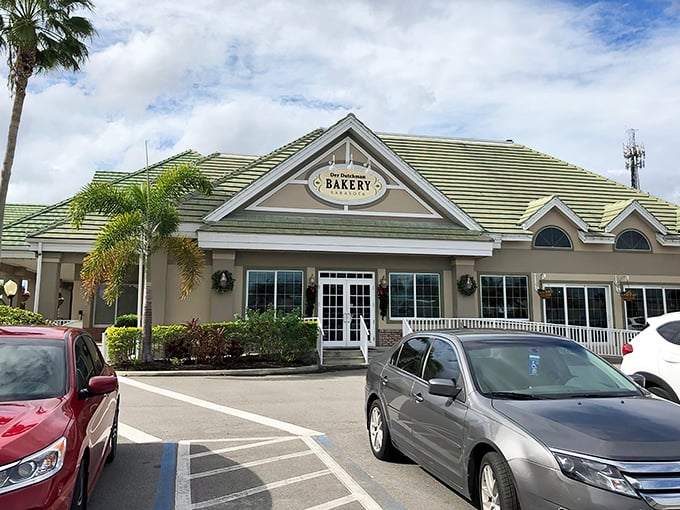 Where Amish tradition meets Florida sunshine. The green-roofed farmhouse style of Der Dutchman creates an unexpected oasis amid swaying palm trees.