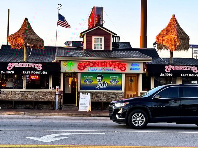 The thatched-roof paradise of Spondivits beckons hungry travelers like a coastal mirage just minutes from Atlanta's busiest airport.