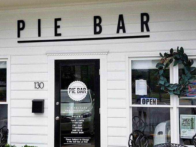 The charming white facade of Pie Bar beckons like a siren song for dessert lovers. Simplicity that promises complexity within.