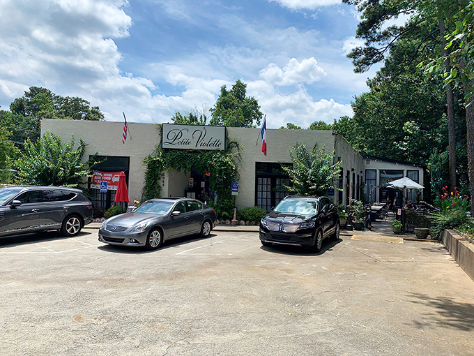 The ivy-draped entrance to Petite Violette beckons like a secret French hideaway. One step through those doors and Atlanta disappears behind you.
