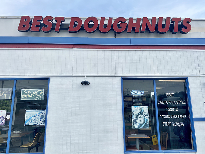 The unassuming white building with its bold red sign promises what lies within: donut perfection without pretension. Simplicity at its finest.