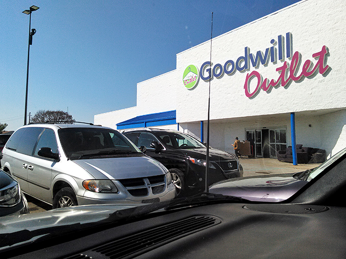 The unassuming exterior of Goodwill Outlet belies the treasure-hunting adventure within, like a pirate's chest disguised as an ordinary shipping container.