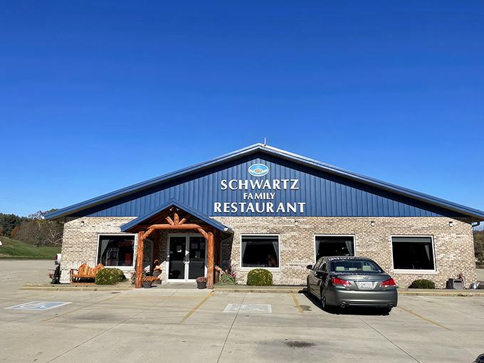 The blue-roofed haven of homestyle cooking stands proudly against an Indiana sky, promising comfort food that'll make your soul sing.