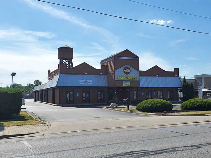 The iconic Texas Corral exterior stands like a Western movie set in suburban Indiana, complete with that charming water tower that says "yes, serious beef happens here."