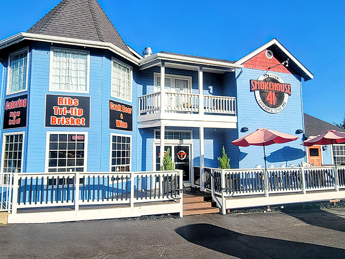 The blue Victorian-style building housing Smokehouse 41 stands like a beacon of barbecue hope in Oakhurst, promising smoky treasures within its welcoming walls.