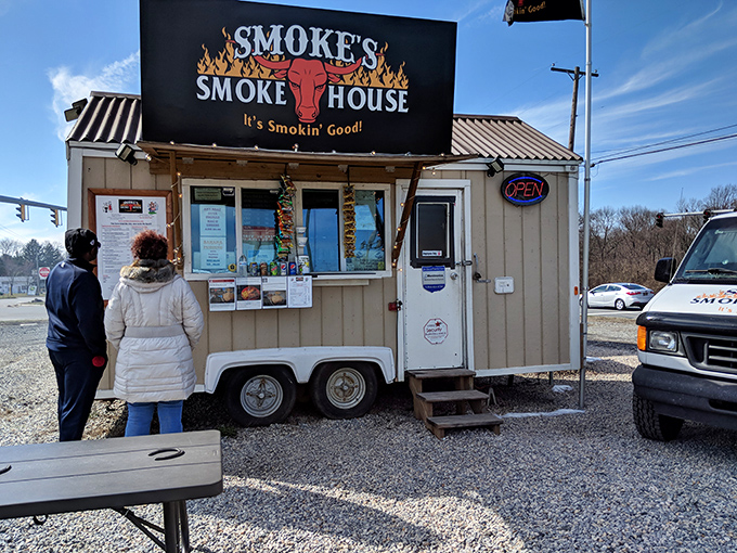 The humble chariot of smoke and glory. Smoke's Smokehouse trailer sits unassumingly in Newark, promising barbecue treasures that far exceed its modest appearance.