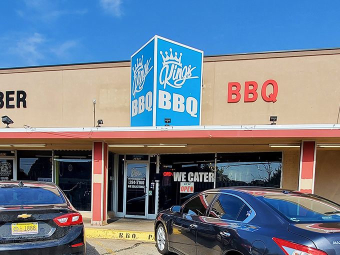 The blue crown sign beckons like a barbecue lighthouse. At King's, they don't need fancy exteriors when what's inside speaks volumes.